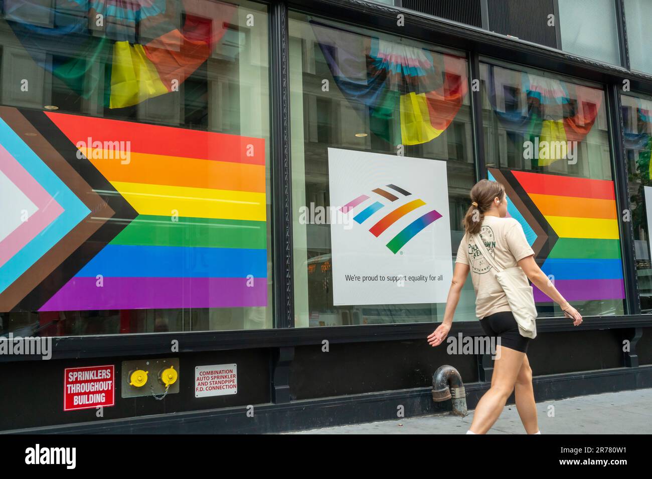 The window of a Bank of America branch in the Flatiron neighborhood in New York displays the ...