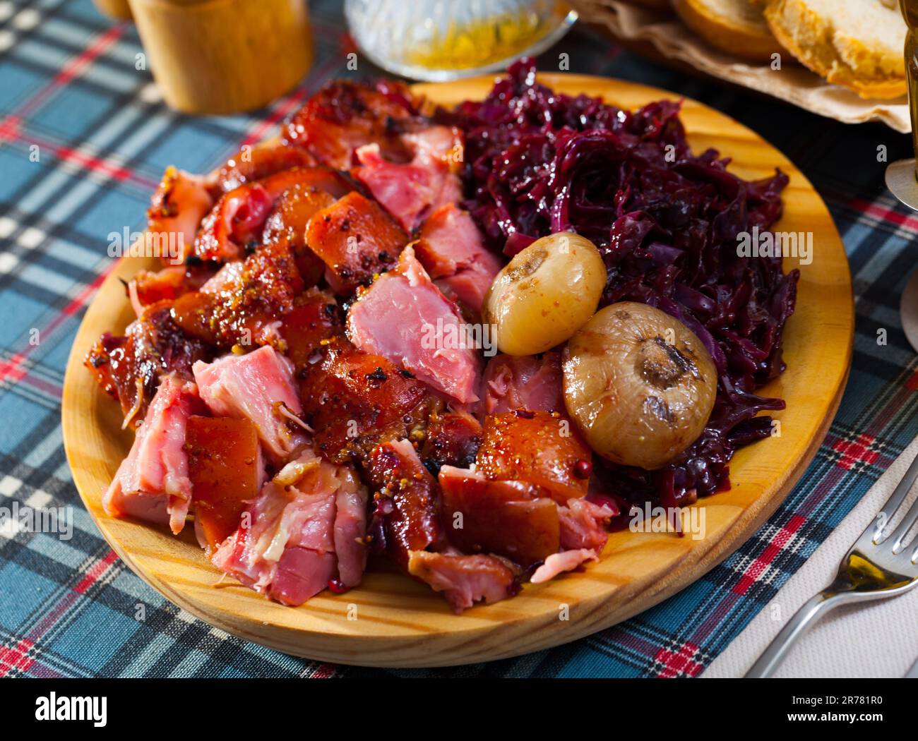 Chopped baked pork knuckle with braised cabbage Stock Photo - Alamy