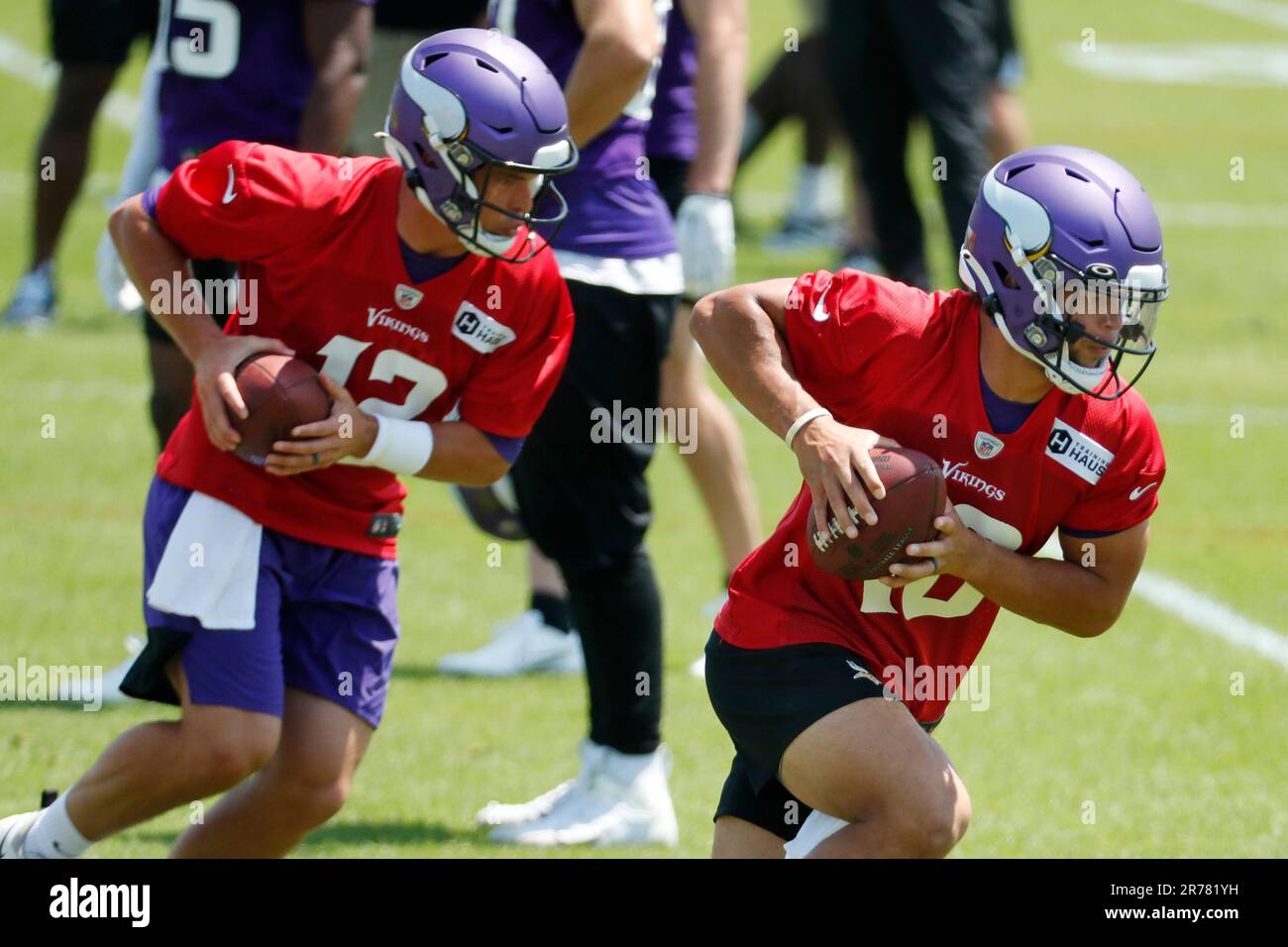 Minnesota Vikings quarterbacks Nick Mullins, left, and Jaren Hall run ...