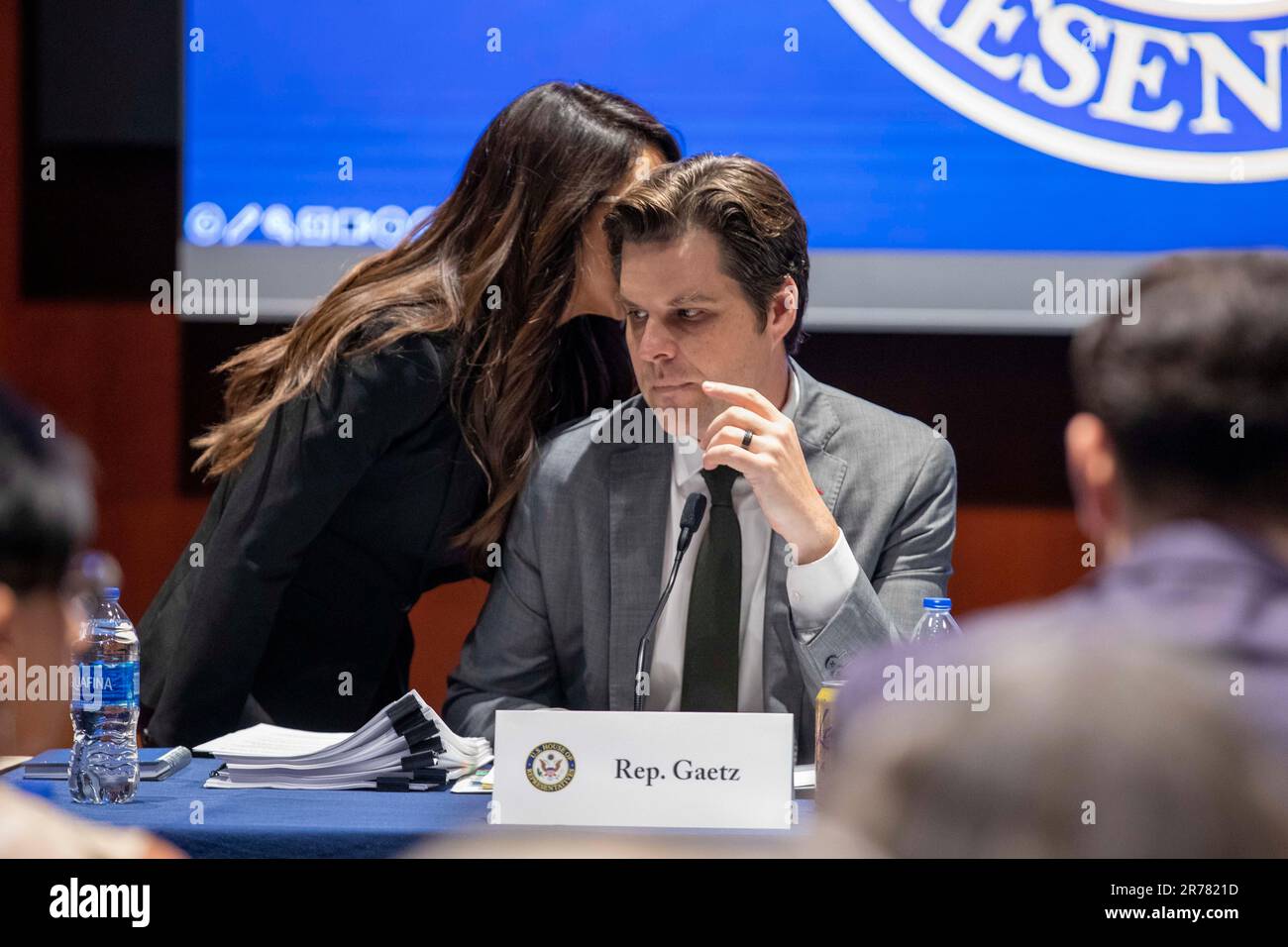 Rep. Lauren Boebert, R-Colo., whispers into the ear of Rep. Matt Gaetz ...