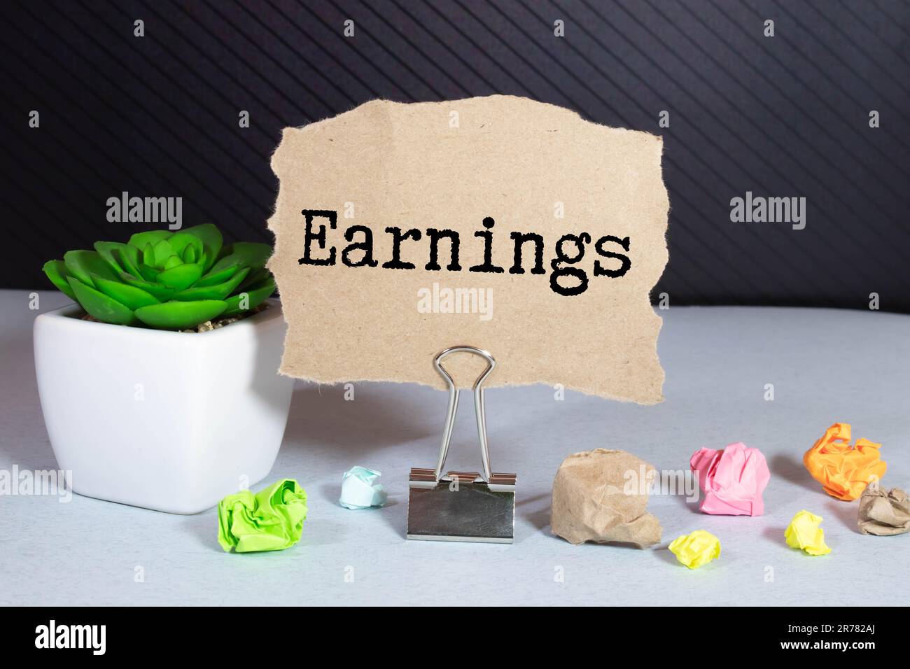 EARNINGS word made with building cubes, business concept Stock Photo ...