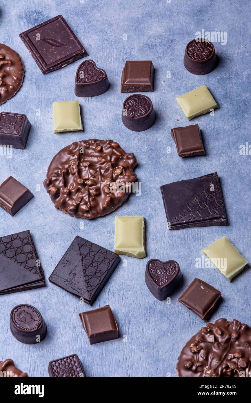 Variety of chocolate products photographed in studio on a light grey ...