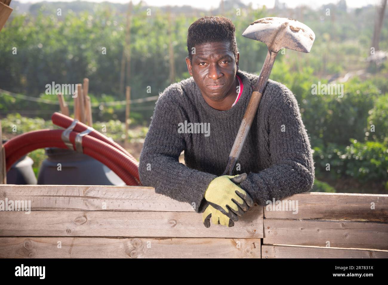 Portrait of american male gardener with shovel Stock Photo - Alamy