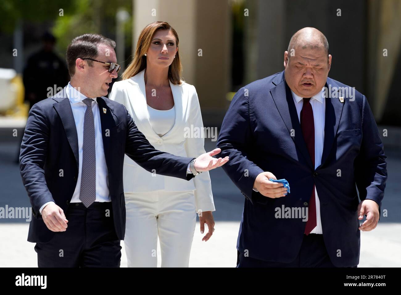 Alina Habba, lawyer for former President Donald Trump, center, and ...