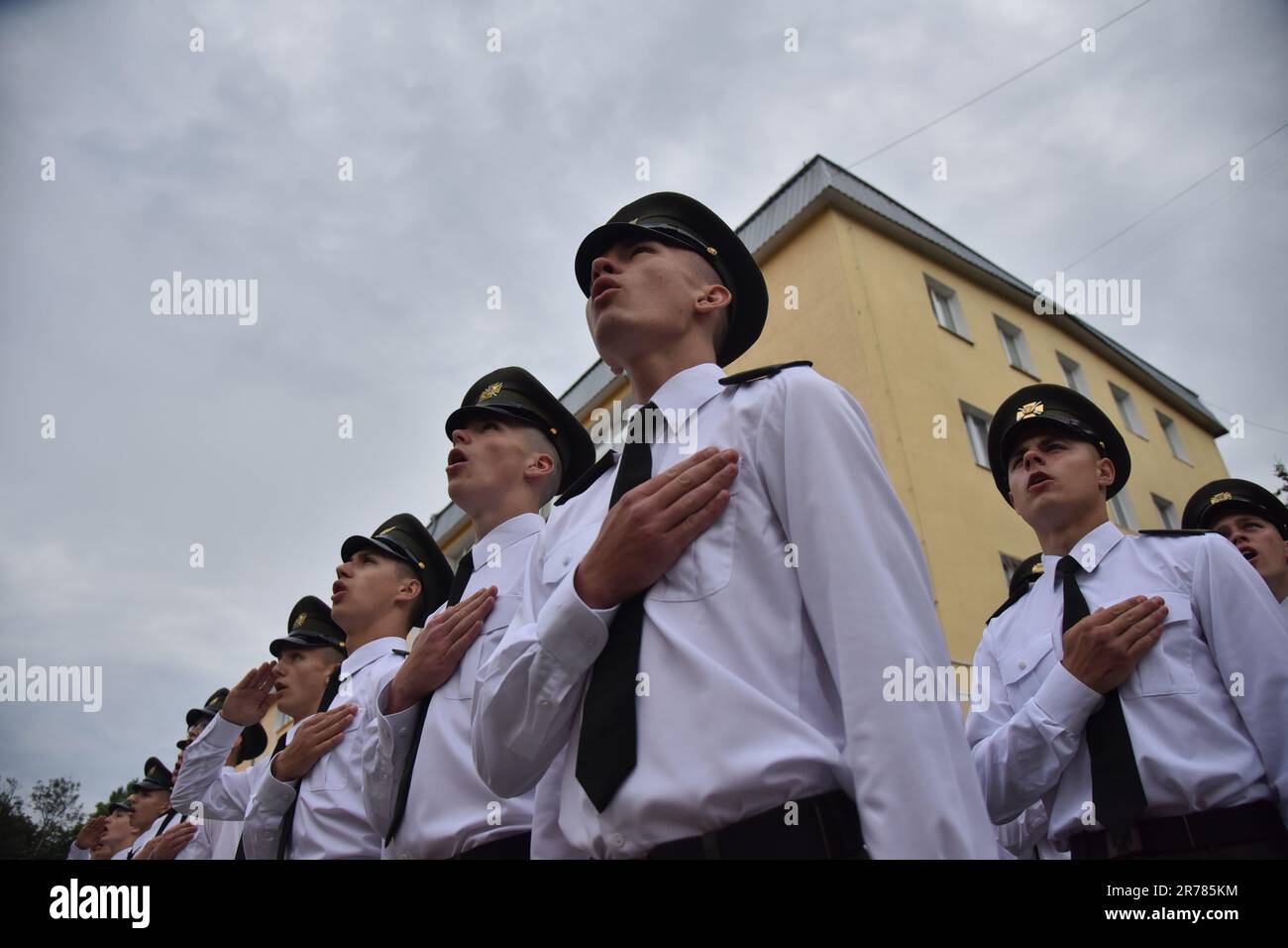 Cadets sing the national anthem of Ukraine during the graduation ...