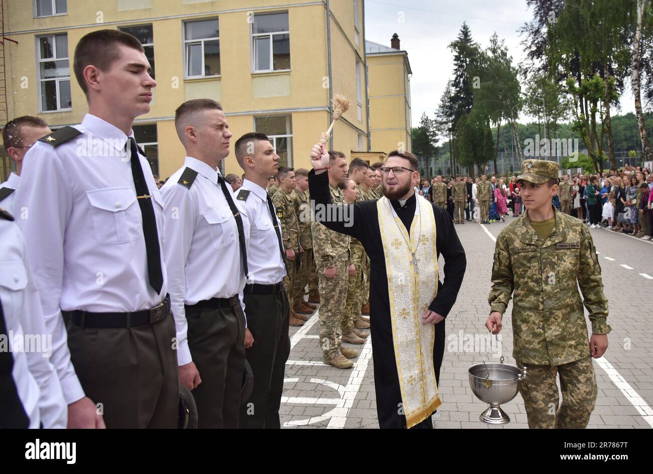 June 10, 2023, Lviv, Ukraine: A priest sprinkles cadets with holy water ...