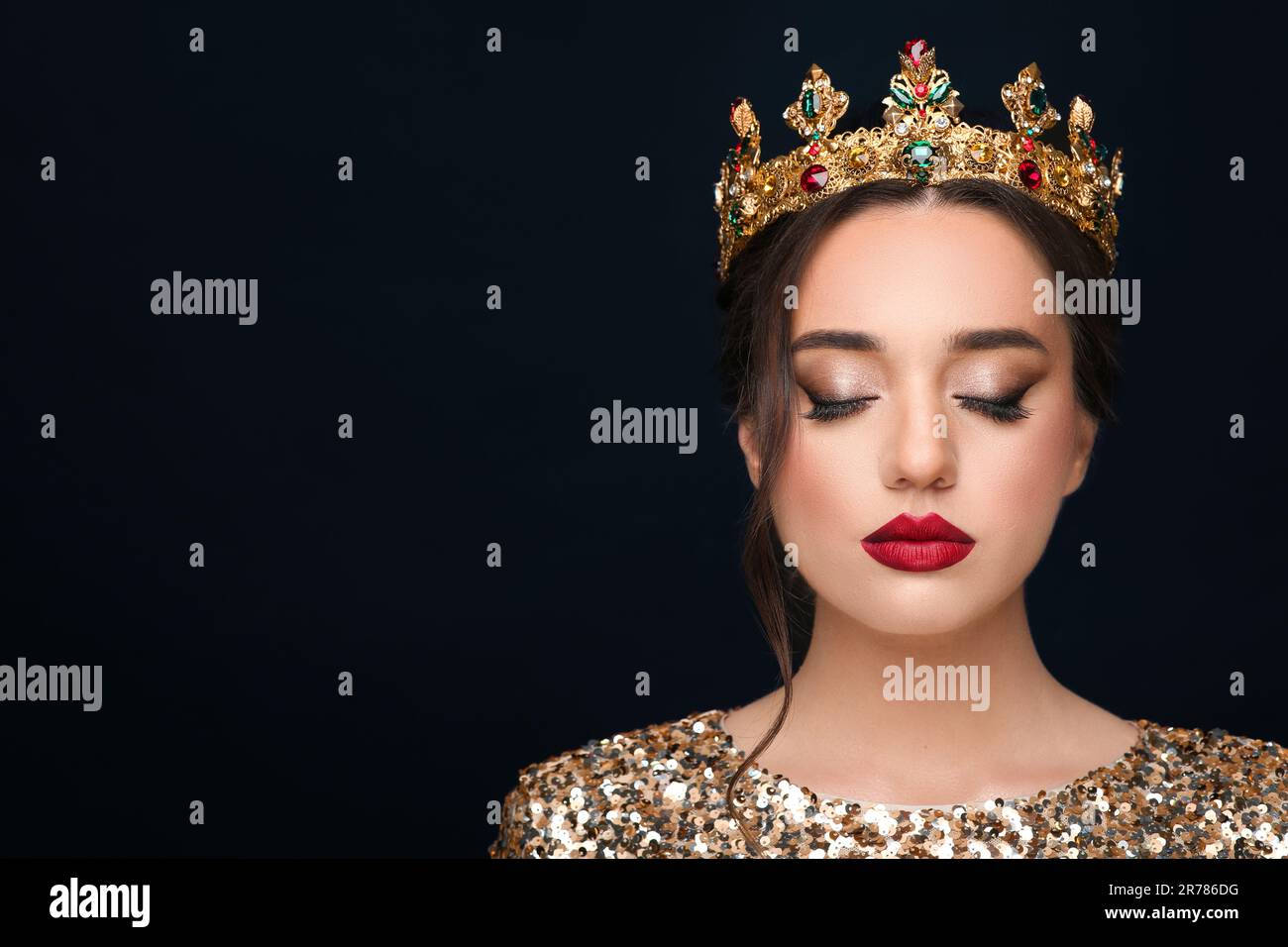Beautiful young woman wearing luxurious crown on black background, space for text Stock Photo ...