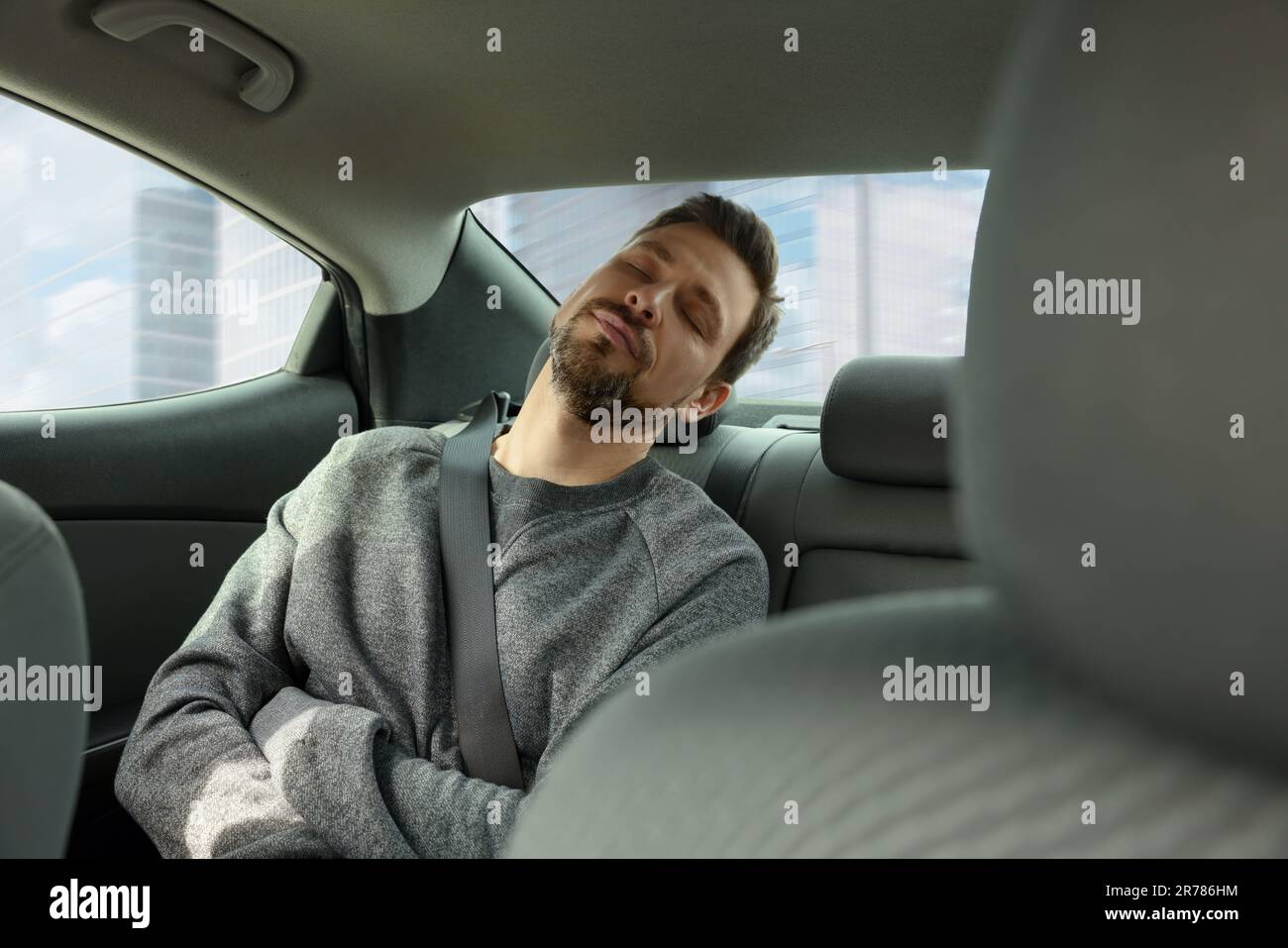 Tired handsome man sleeping in his modern car Stock Photo - Alamy