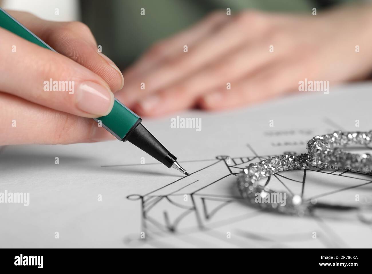 Jeweler drawing sketch of diamond on paper, closeup Stock Photo - Alamy