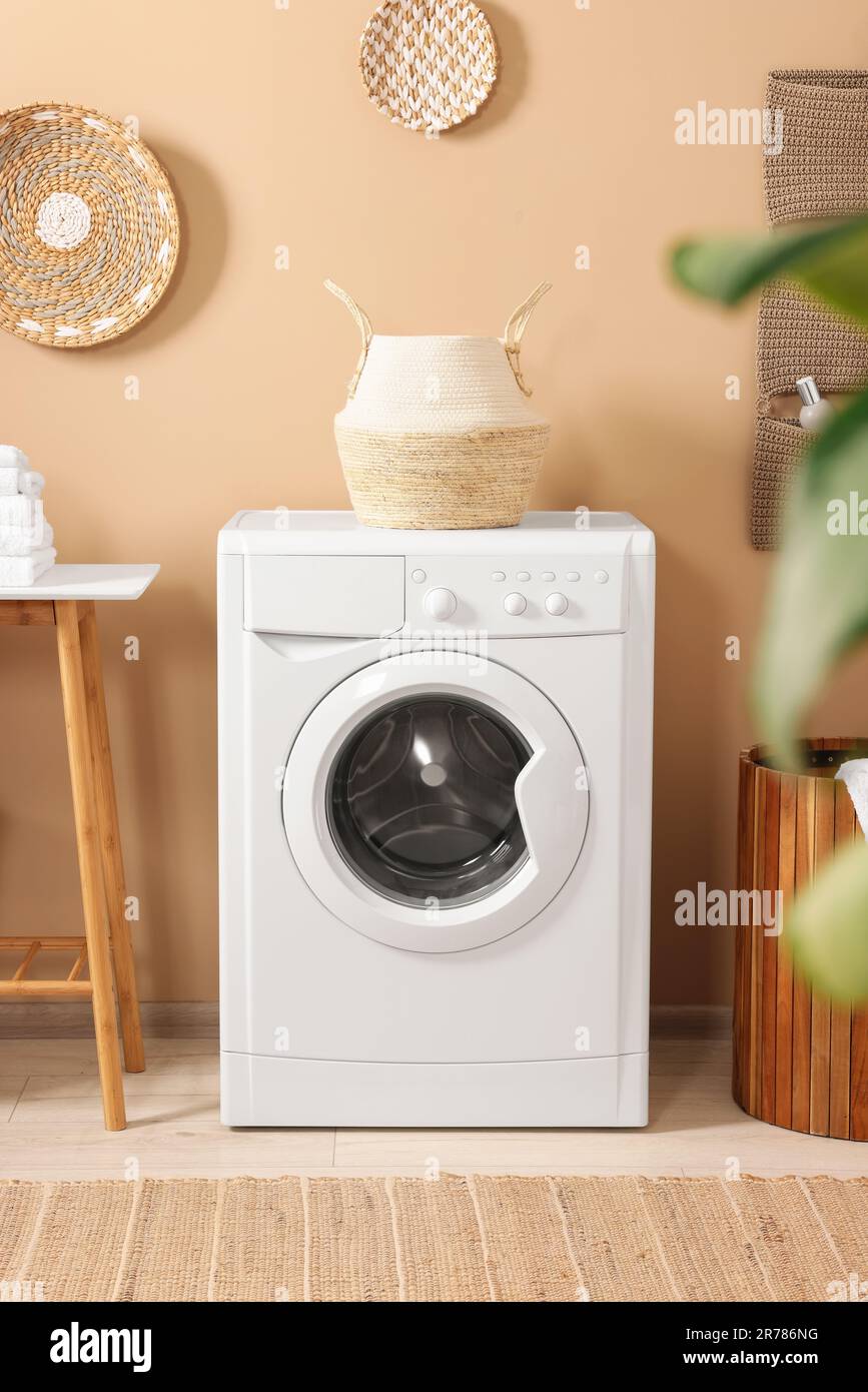 Stylish laundry room with modern washing machine. Interior design Stock ...