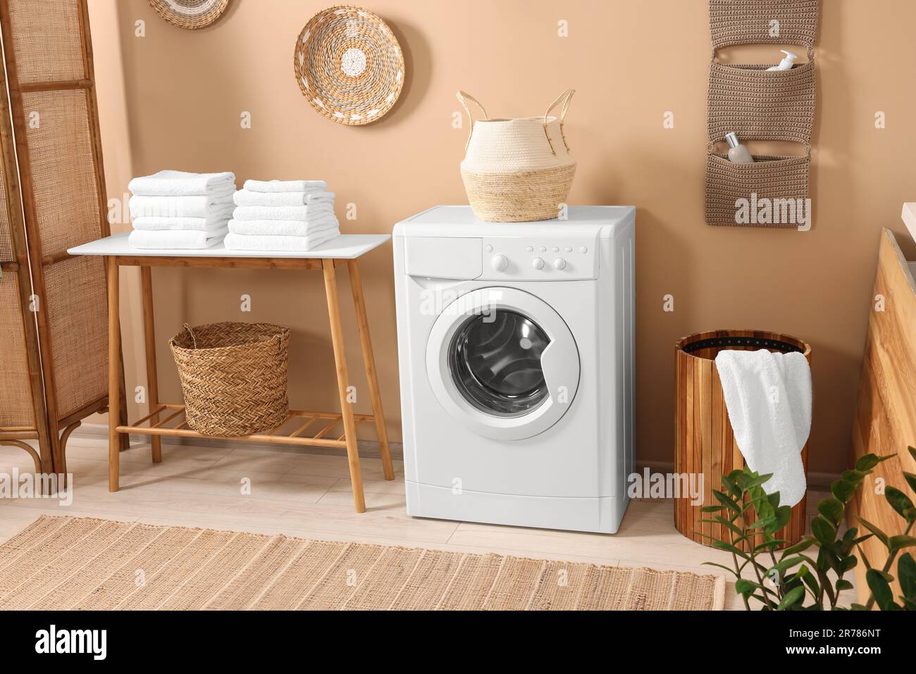 Stylish laundry room with modern washing machine. Interior design Stock ...