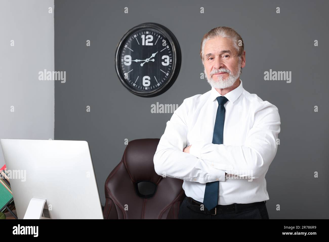 Serious senior successful boss in his office Stock Photo - Alamy