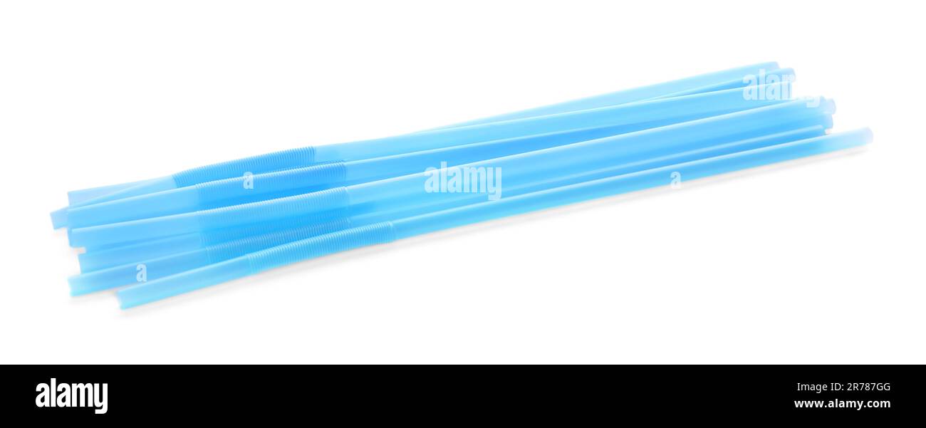 Light blue plastic cocktail straws on white background Stock Photo - Alamy