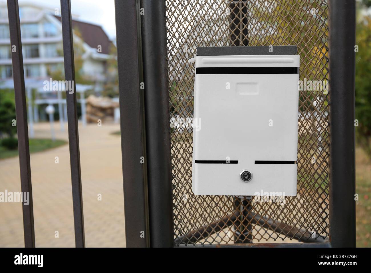 White metal letter box on fence outdoors. Space for text Stock Photo ...