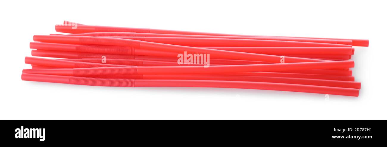 Red plastic cocktail straws on white background Stock Photo - Alamy