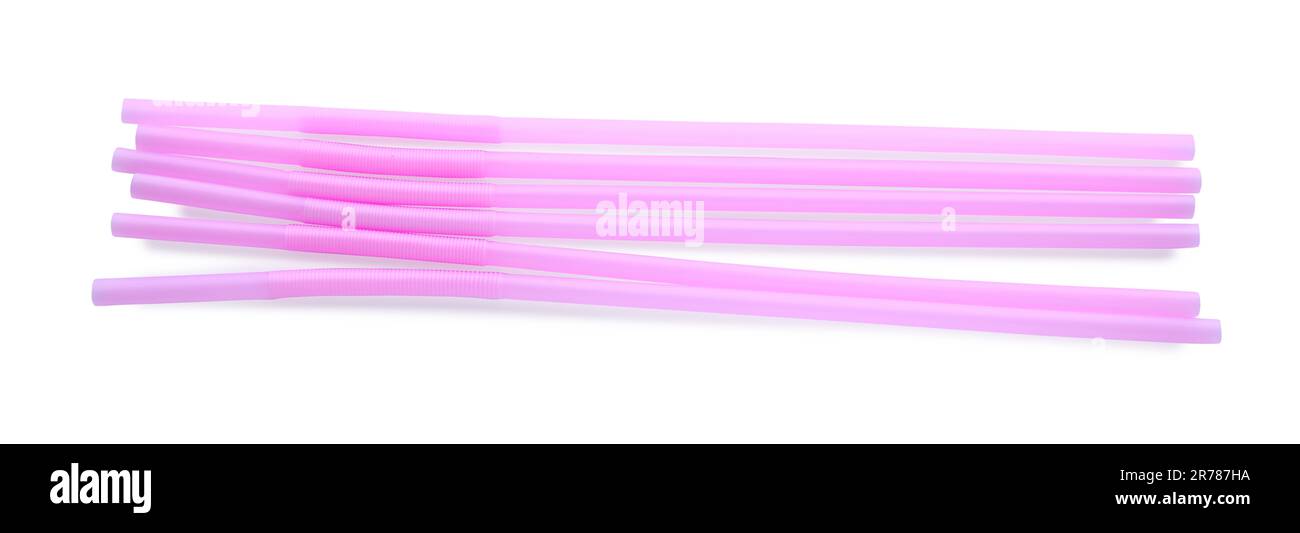 Light pink plastic cocktail straws on white background, top view Stock ...