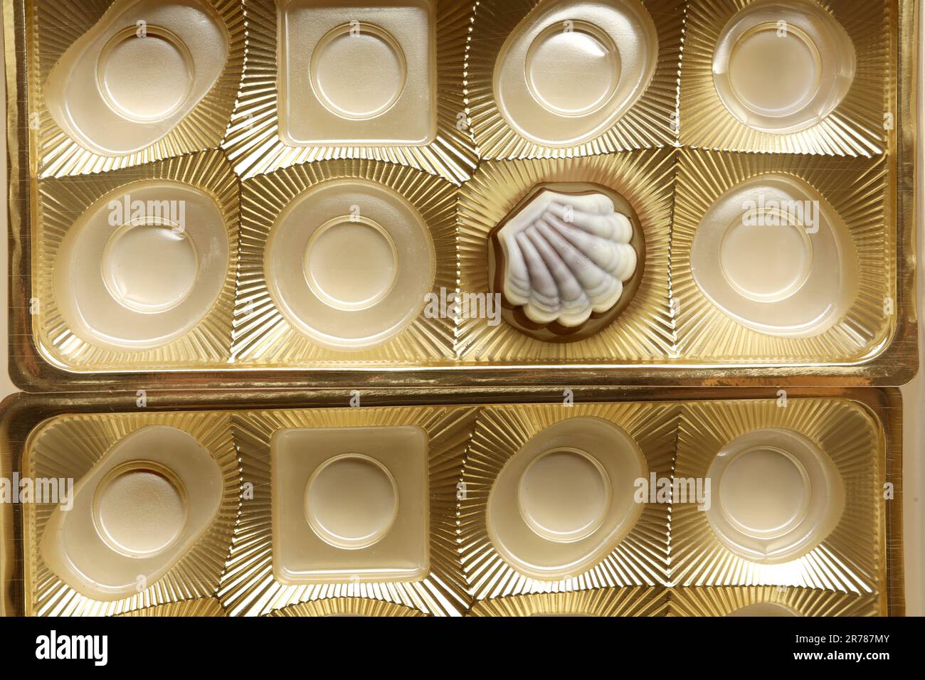 Partially empty box of chocolate candies as background, top view Stock ...