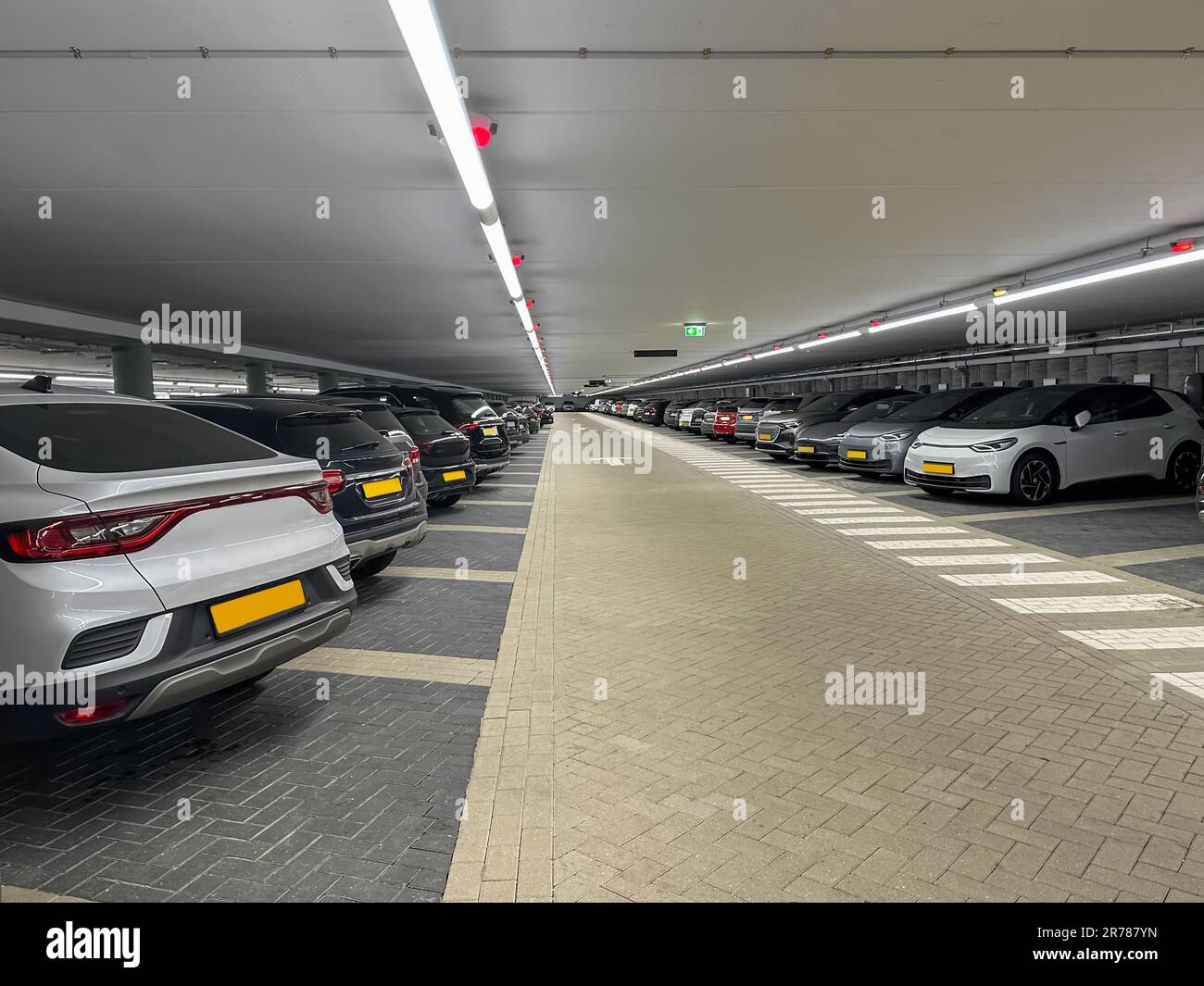 Many different cars in underground parking garage Stock Photo - Alamy