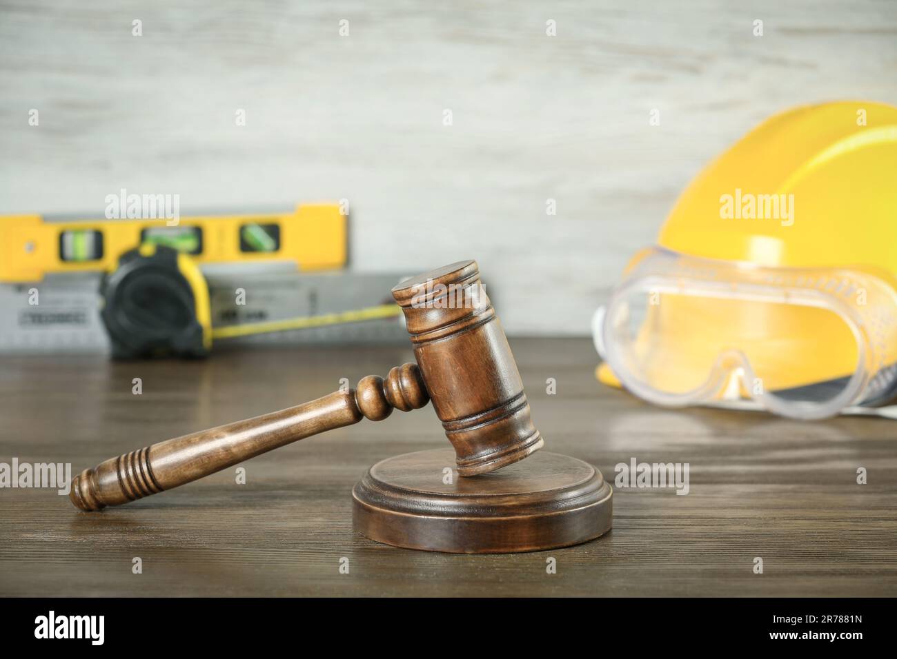 Construction and land law concepts. Judge gavel, protective helmet with ...