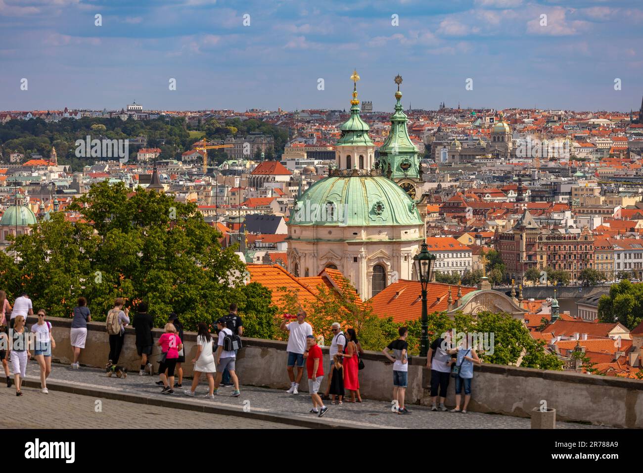 PRAGUE, CZECH REPUBLIC, EUROPE - Tourists walk in front of dome of St ...