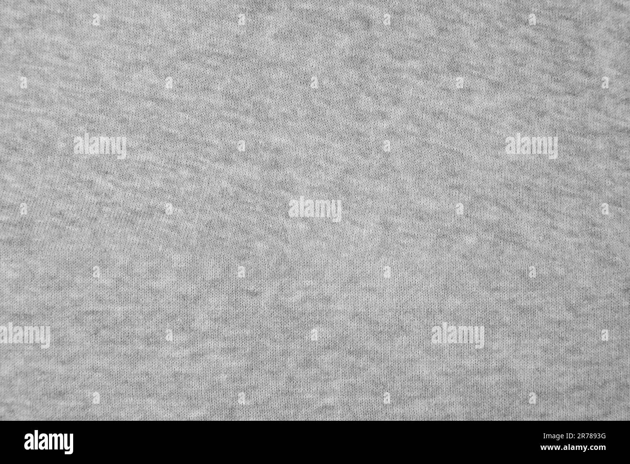 Light grey cloth with lint as background, top view. Before using fabric ...