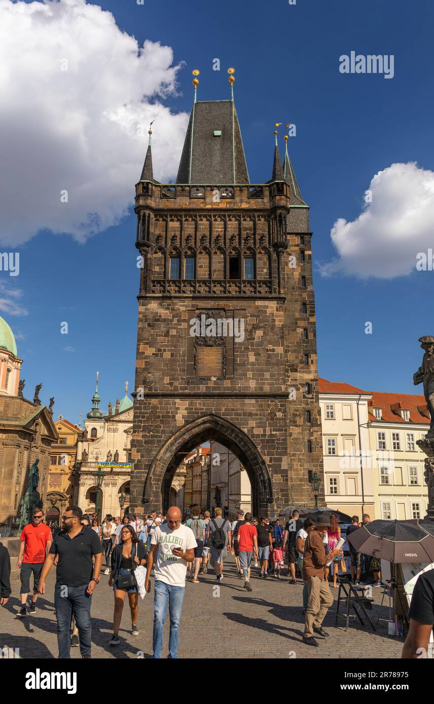 PRAGUE, CZECH REPUBLIC, EUROPE - The Old Town Bridge Tower, and tourists crossing Charles Bridge ...