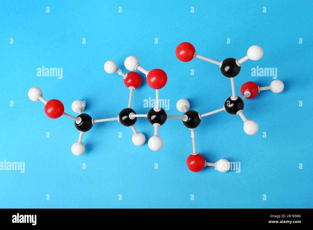 Molecule of glucose on light blue background, above view. Chemical ...