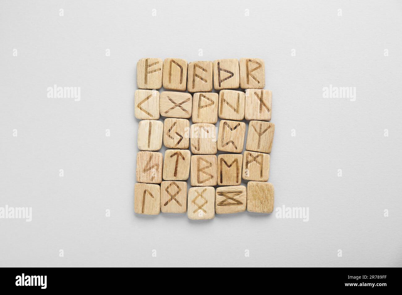 Wooden runes on white background, top view Stock Photo - Alamy