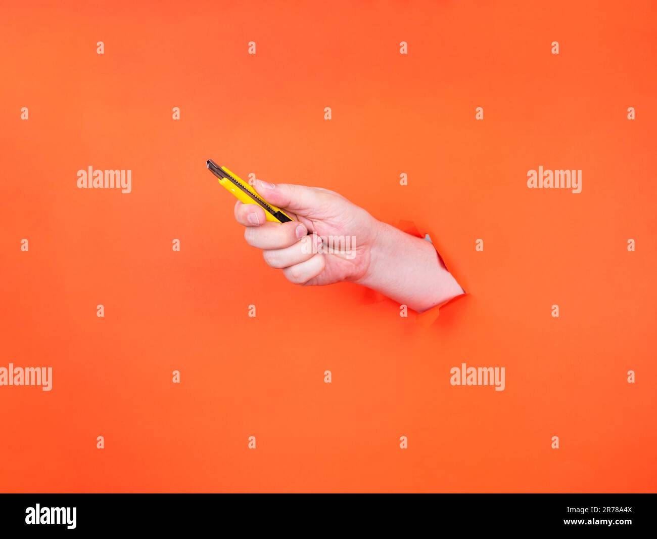 Mans hand cutting through hi-res stock photography and images - Alamy
