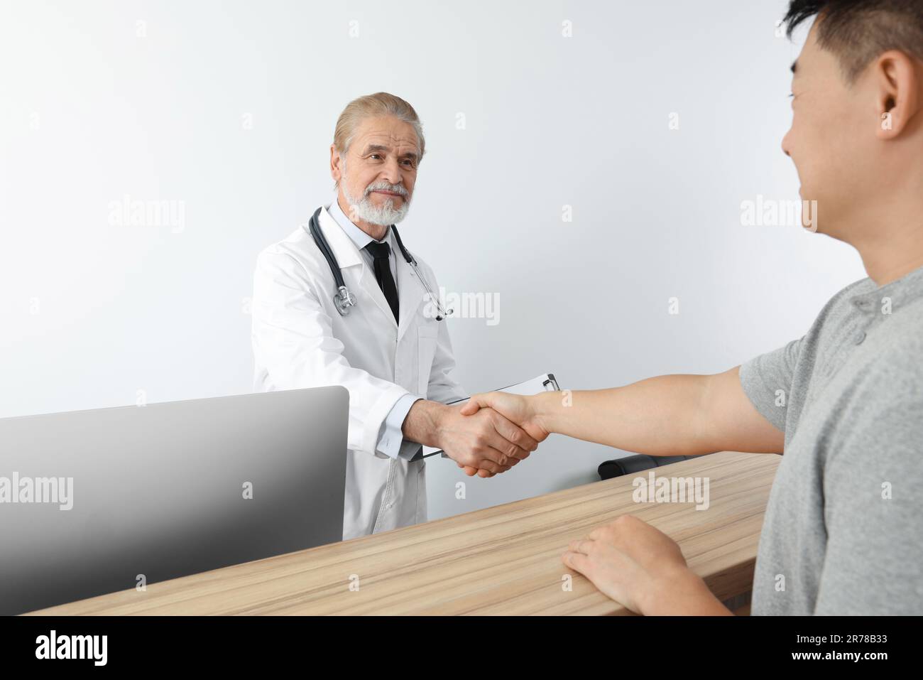 Male asian doctor shaking hi-res stock photography and images - Alamy