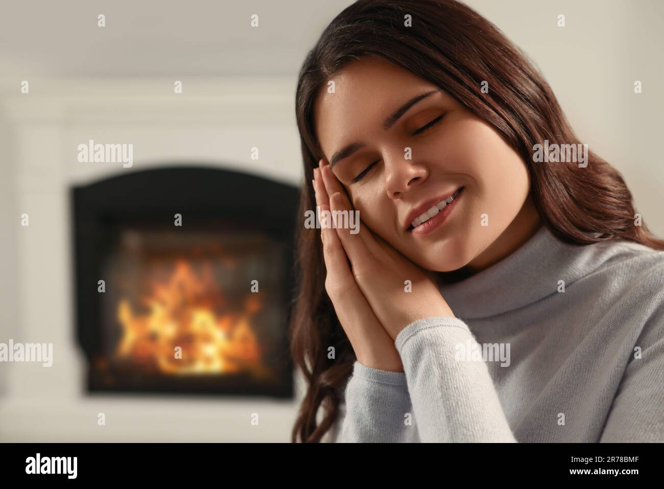 Woman sleeping fireplace hi-res stock photography and images - Alamy