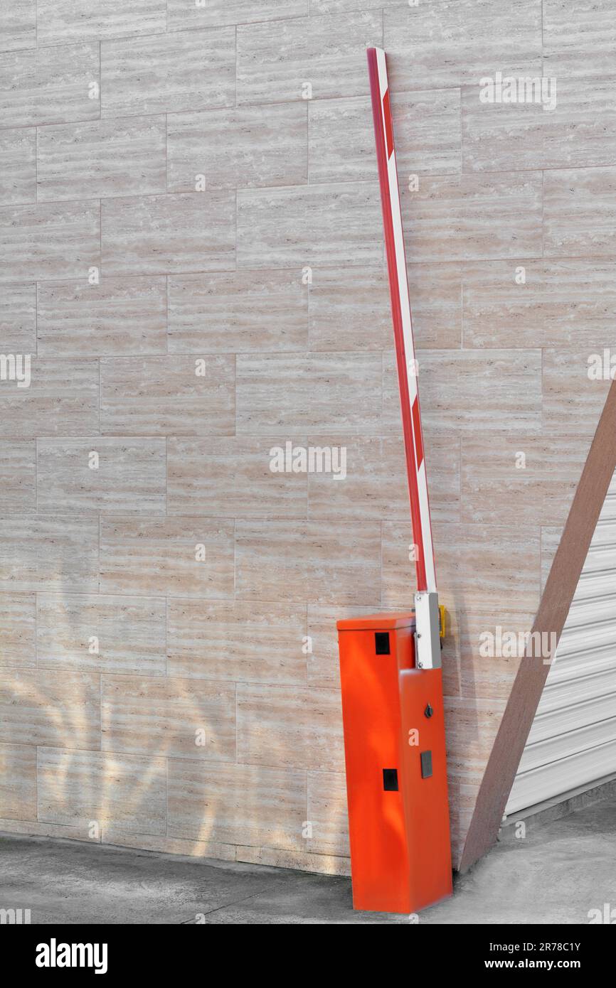 Open boom barrier outdoors on sunny day, space for text Stock Photo - Alamy