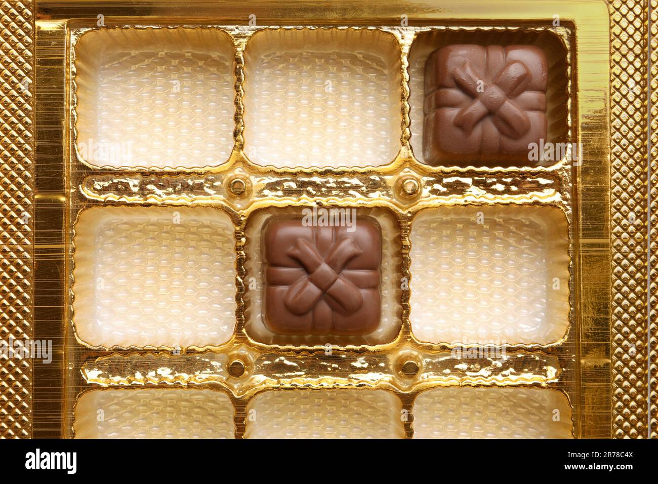 Partially empty box of chocolate candies as background, top view Stock ...