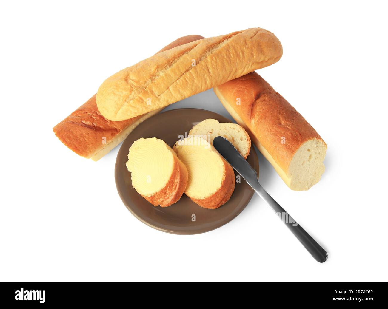 Cut baguettes with fresh butter on white background, above view Stock ...