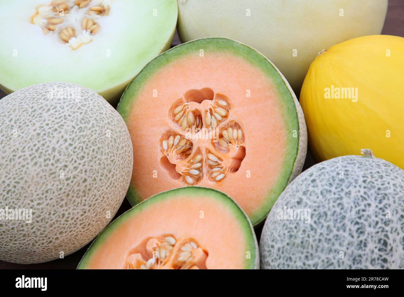 Different types of tasty ripe melons as background, closeup Stock Photo ...