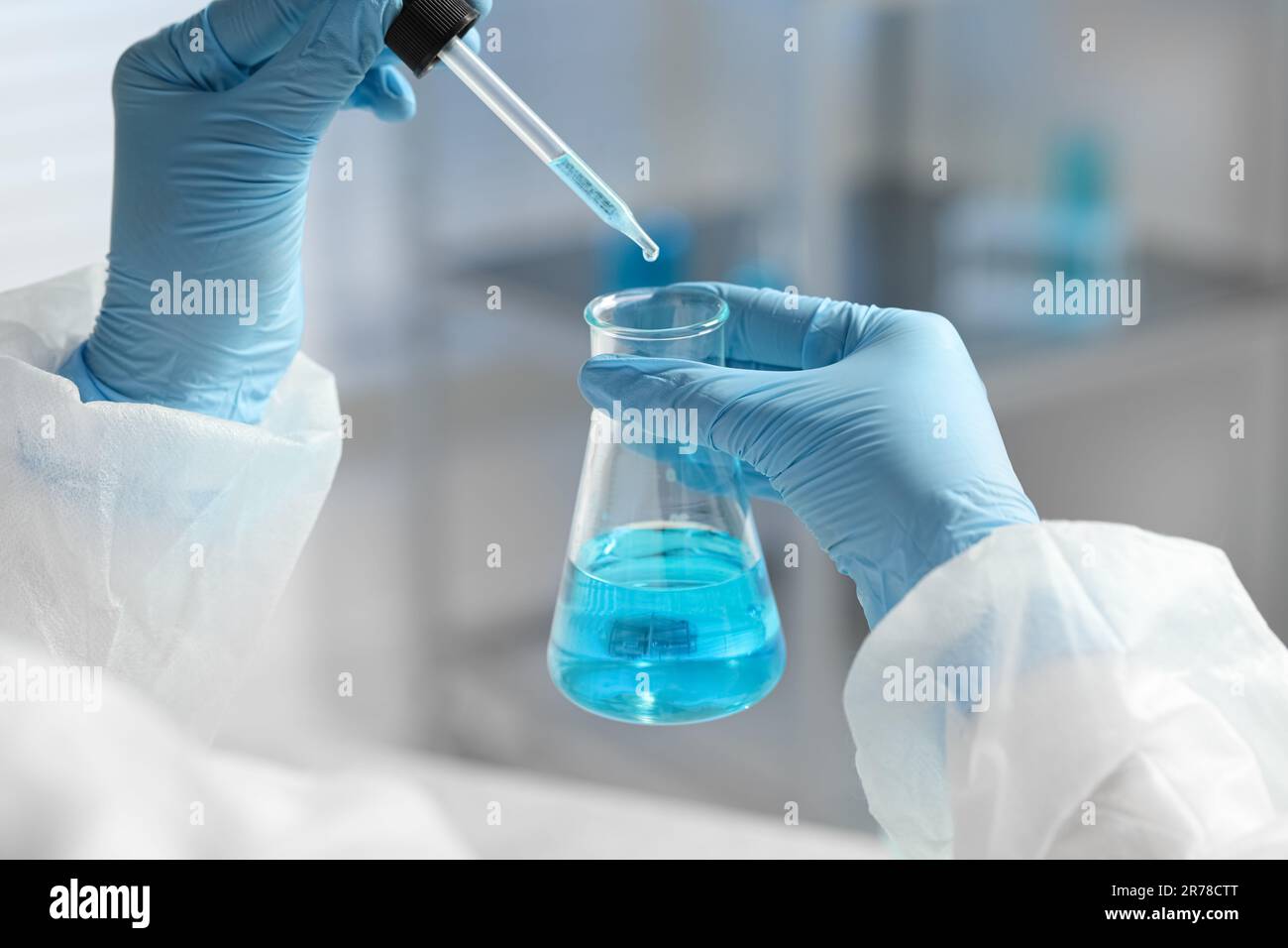 Lab assistant dripping liquid in hi-res stock photography and images ...