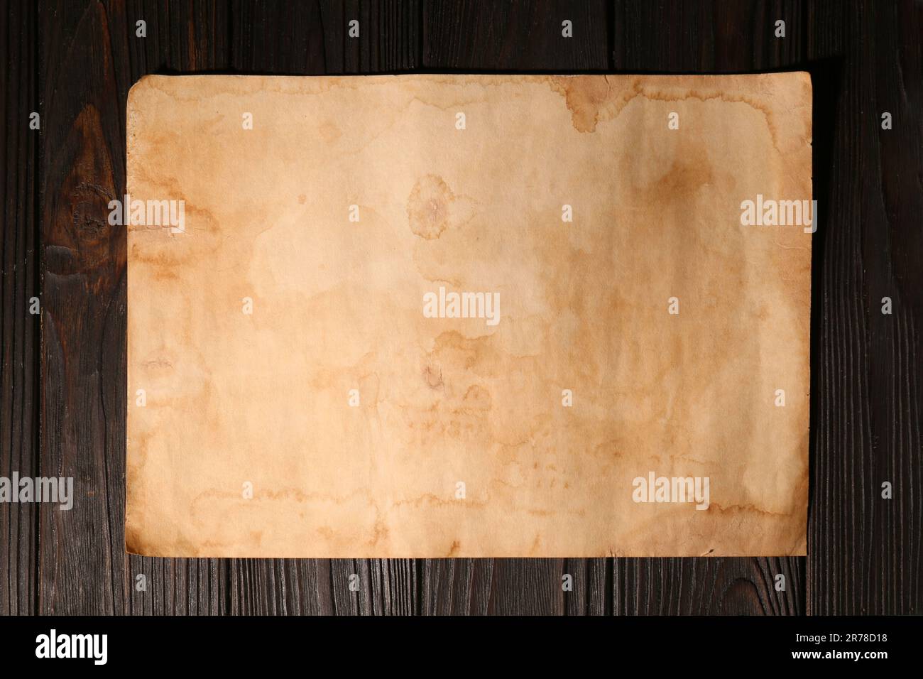 Sheet of old parchment paper on wooden table, top view Stock Photo - Alamy