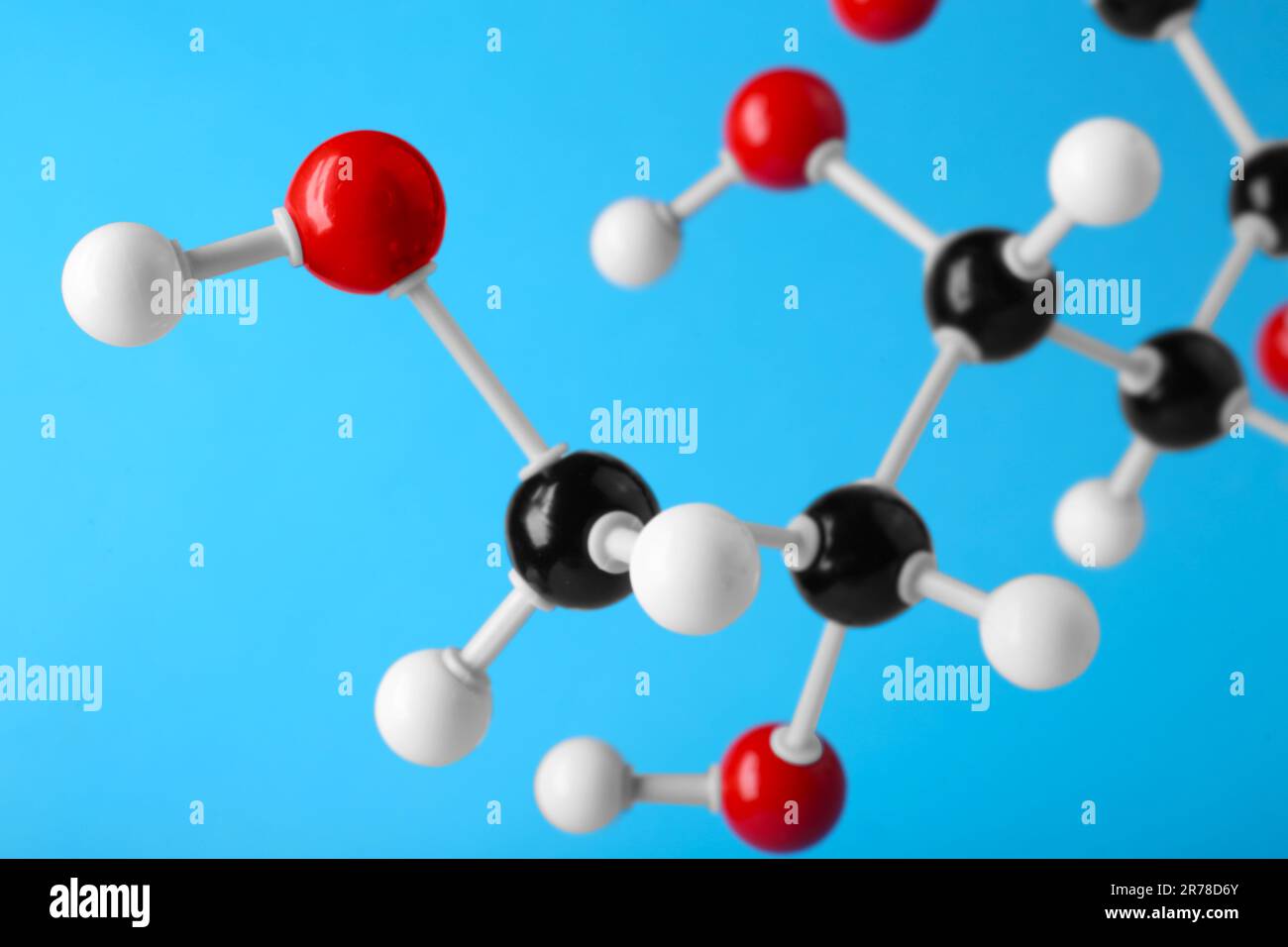Molecule of glucose on light blue background, closeup. Chemical model ...