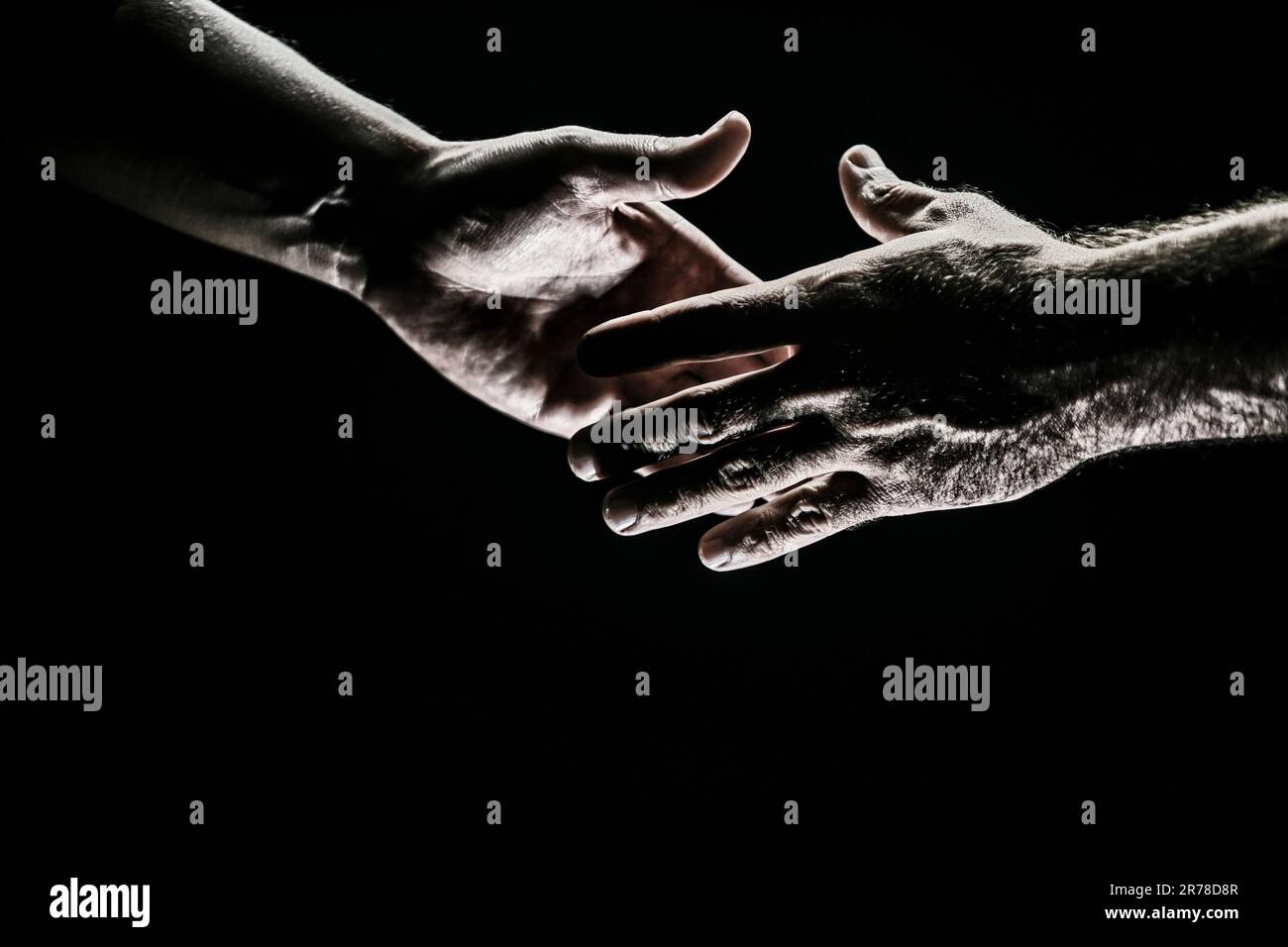 Handshake. Men holding hands isolated on black. Connection and human ...