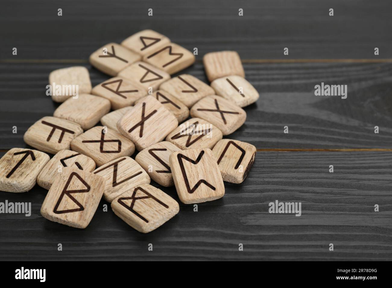 Wooden runes on table hi-res stock photography and images - Alamy