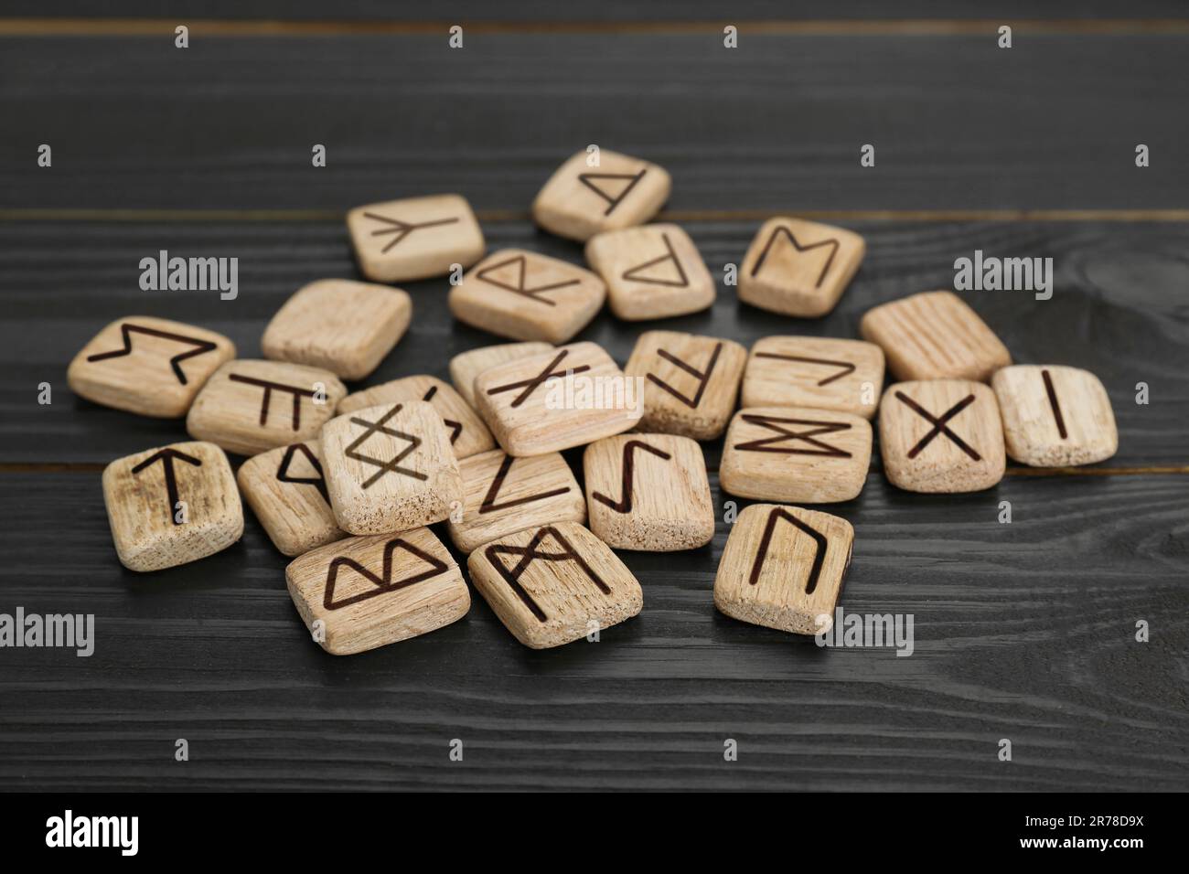 Wooden runes on table hi-res stock photography and images - Alamy