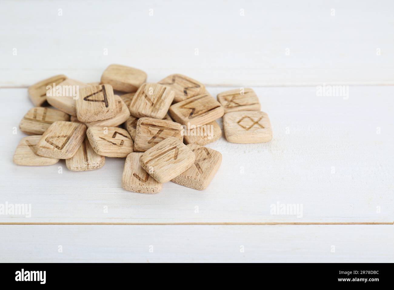 Wooden runes on table hi-res stock photography and images - Alamy