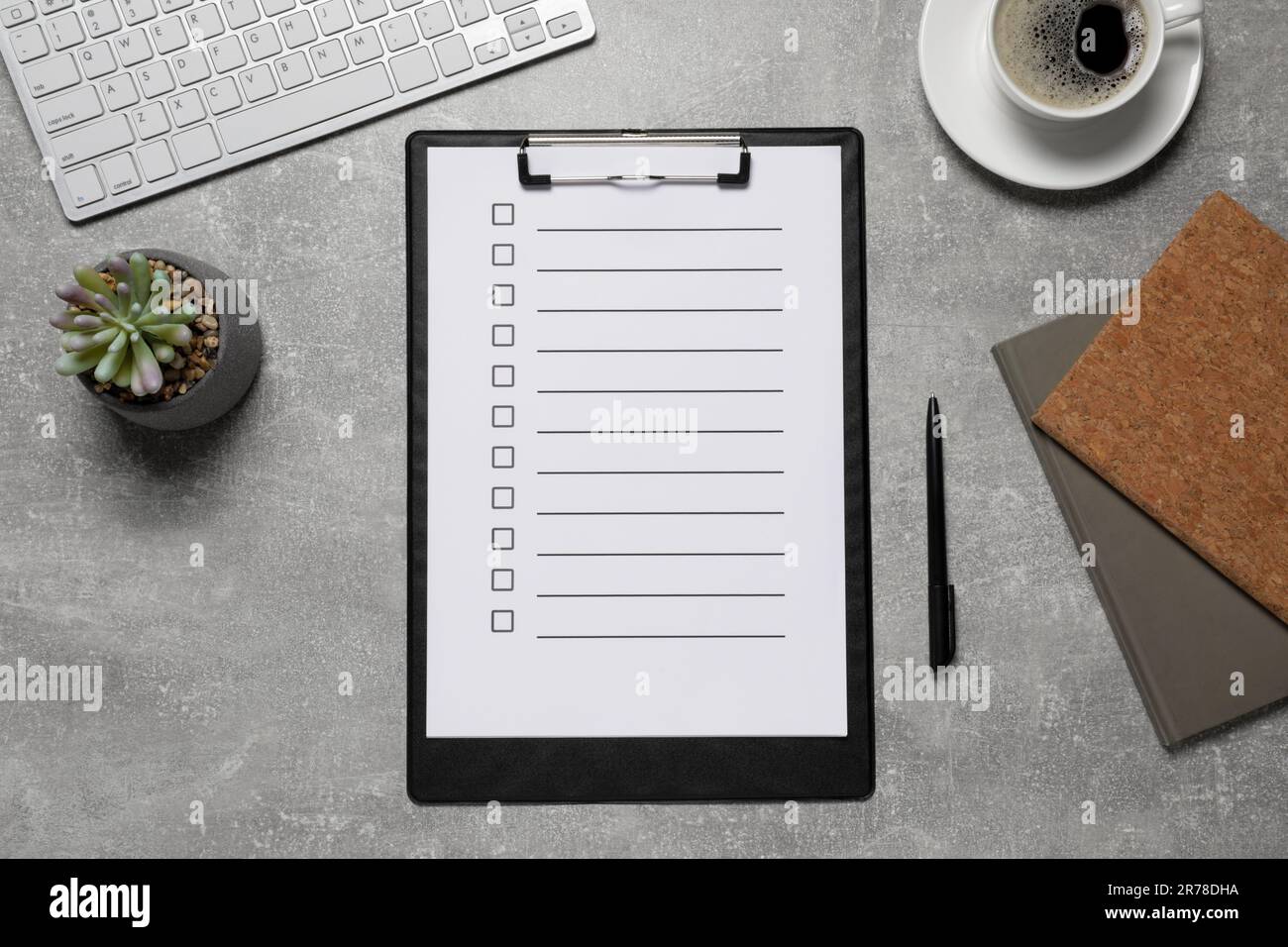 Clipboard with checkboxes, cup of coffee plant and computer keyboard on ...