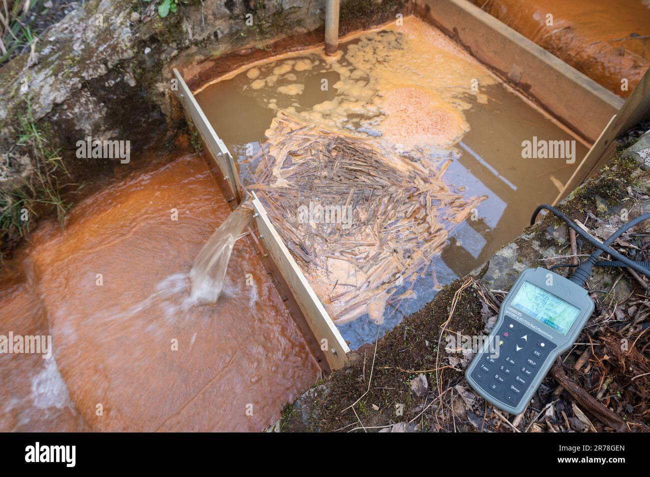 pH meter measuring treated water from disused coal mine. Photographed ...
