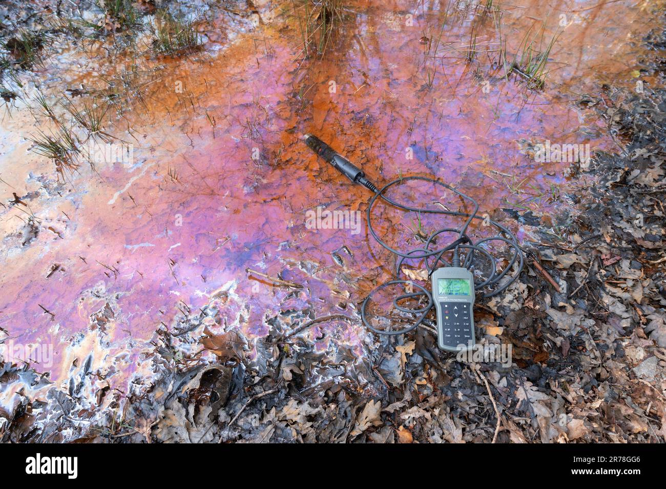 pH meter measuring treated water from disused coal mine. Photographed ...