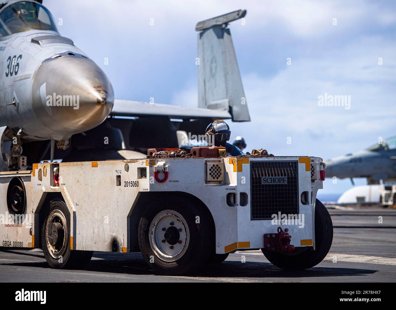 230613-N-MH015-2016 PACIFIC OCEAN (June 13, 2023) A U.S. Navy Sailor tows an F/A-18E Super ...