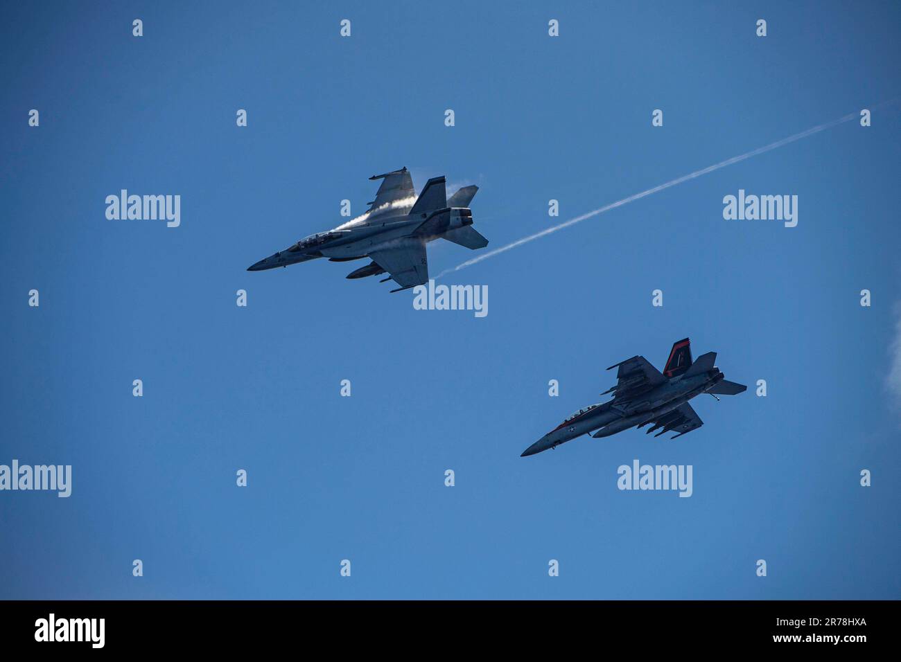 230613-N-MH015-2122 PACIFIC OCEAN (June 13, 2023) Two F/A-18F Super Hornets from the “Mighty ...