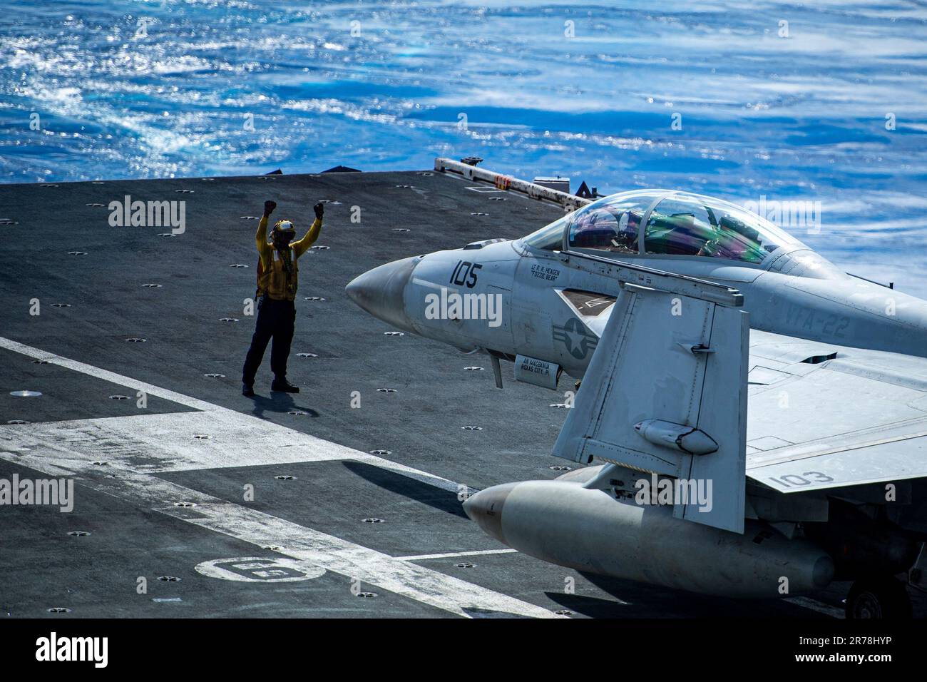 230613-N-XK462-1075 PACIFIC OCEAN (June 13, 2023) A U.S. Navy Sailor directs an F/A-18F Super ...