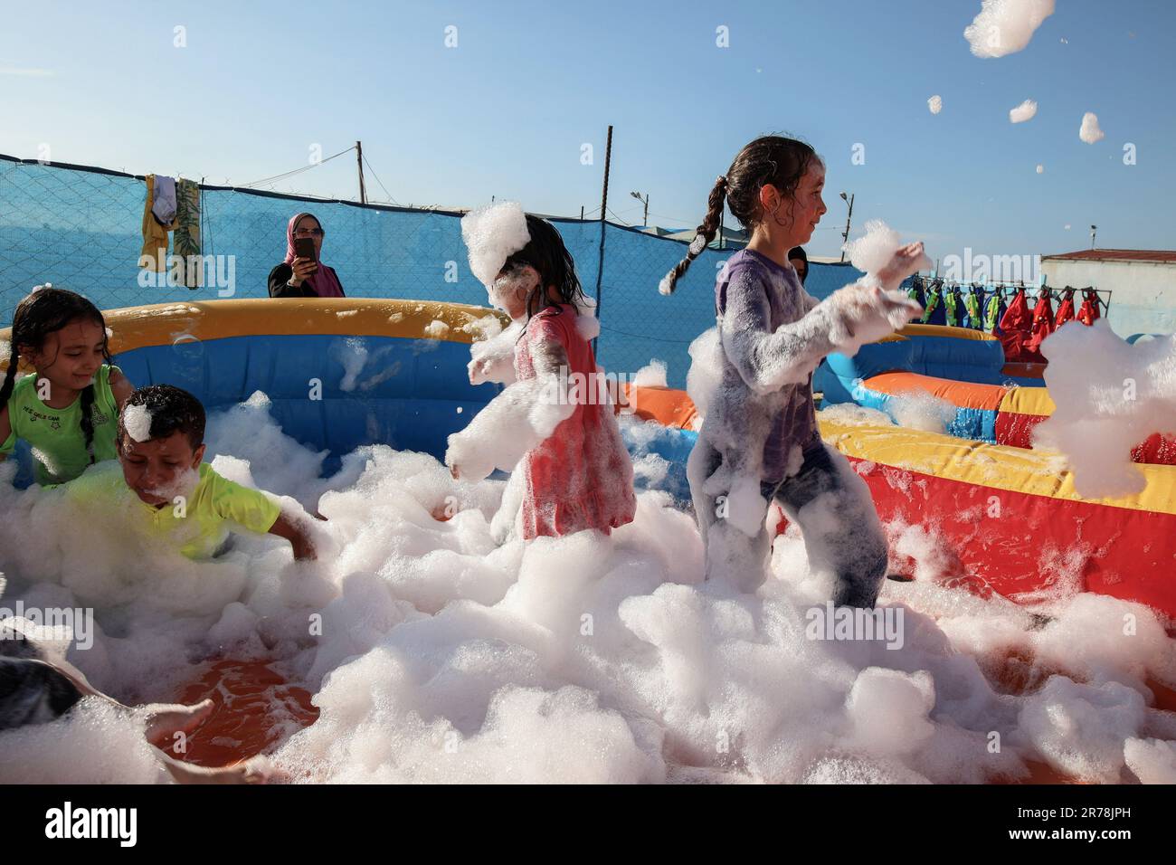 Gaza, Palestine. 12th June, 2023. Palestinian children play with soap ...