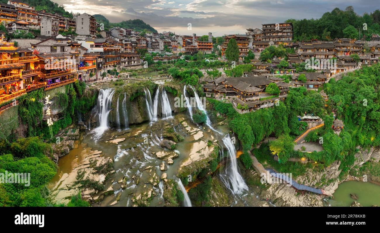 Beautiful ancient town in China with waterfall and traditional houses ...